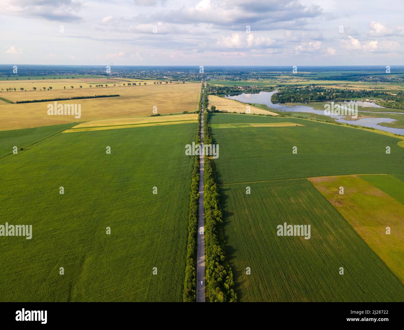 An aerial view of a long road through Ukrainian fields Stock Photo - Alamy