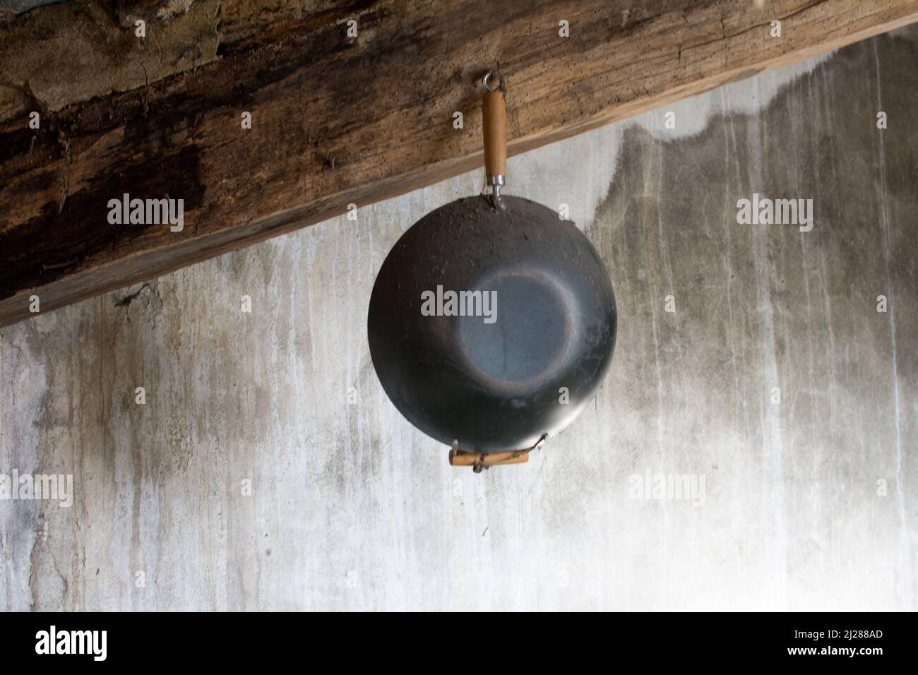 A hanging wok from the ceiling Stock Photo - Alamy