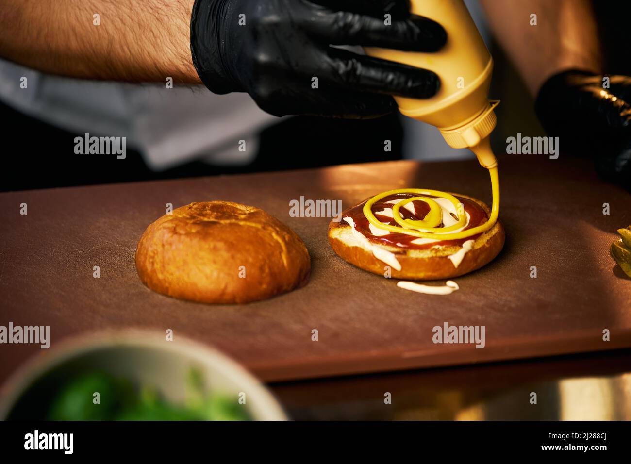 Man hamburger mustard sauce hi-res stock photography and images - Alamy