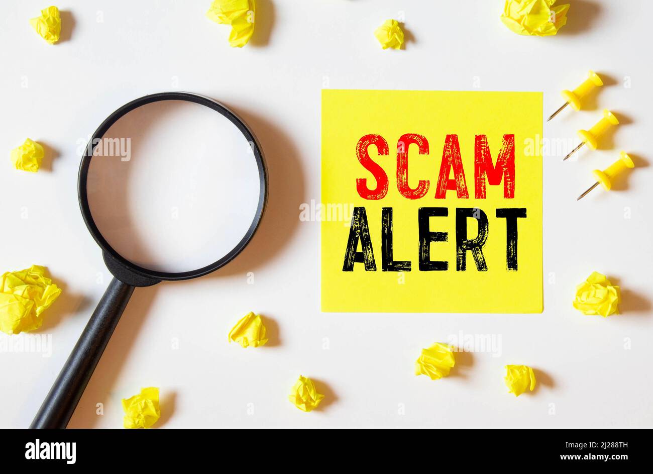 Note with scam alert inscription on the wooden background Stock Photo ...