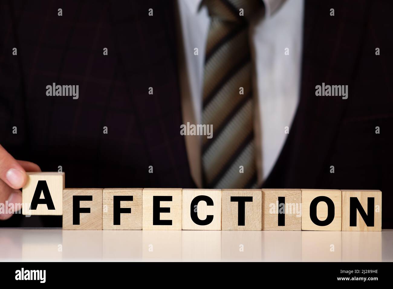 Affection text on wooden block on black texture background Stock Photo ...