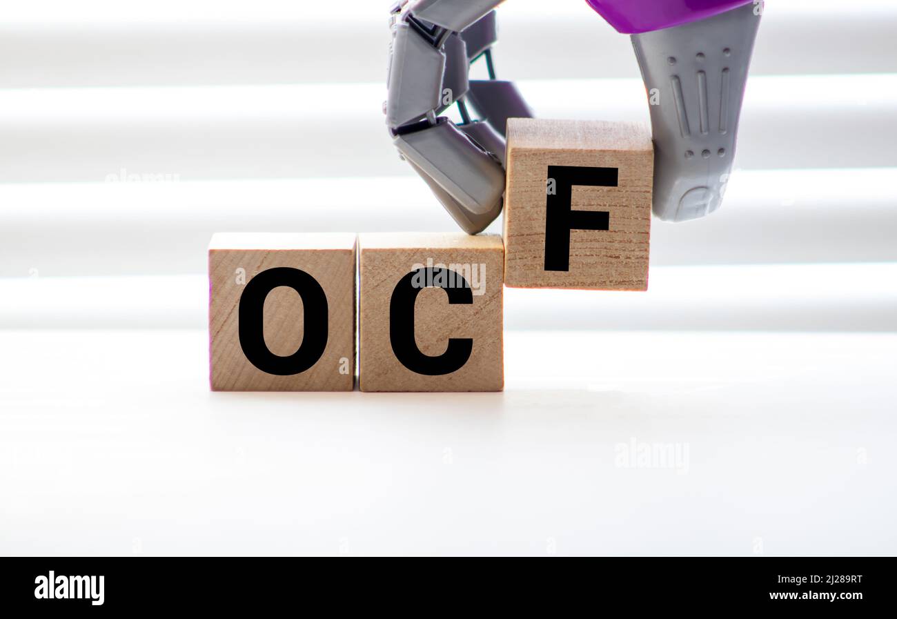 Letter of the alphabet of OCF - Operation Cash Flow - on a light blu ...
