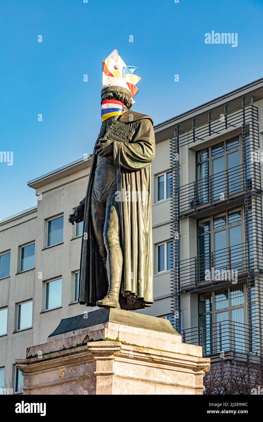 statue of Johannes Gutenberg dressed with a carnival cap and mask in ...