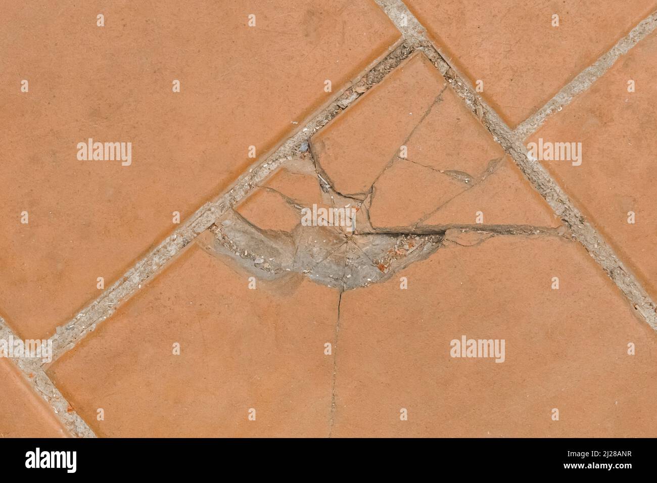 Old brown surface broken tile damage floor repair background ...
