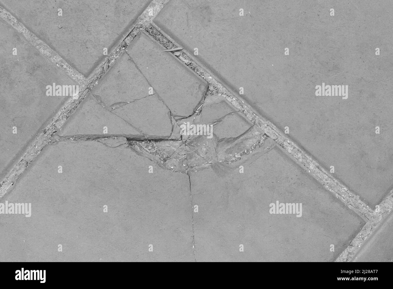 Old gray surface broken tile damage floor repair grey background ...