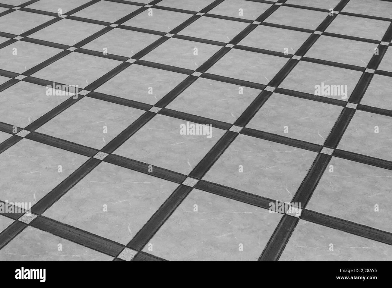 Dark grey floor tile with abstract gray geometric pattern surface ...