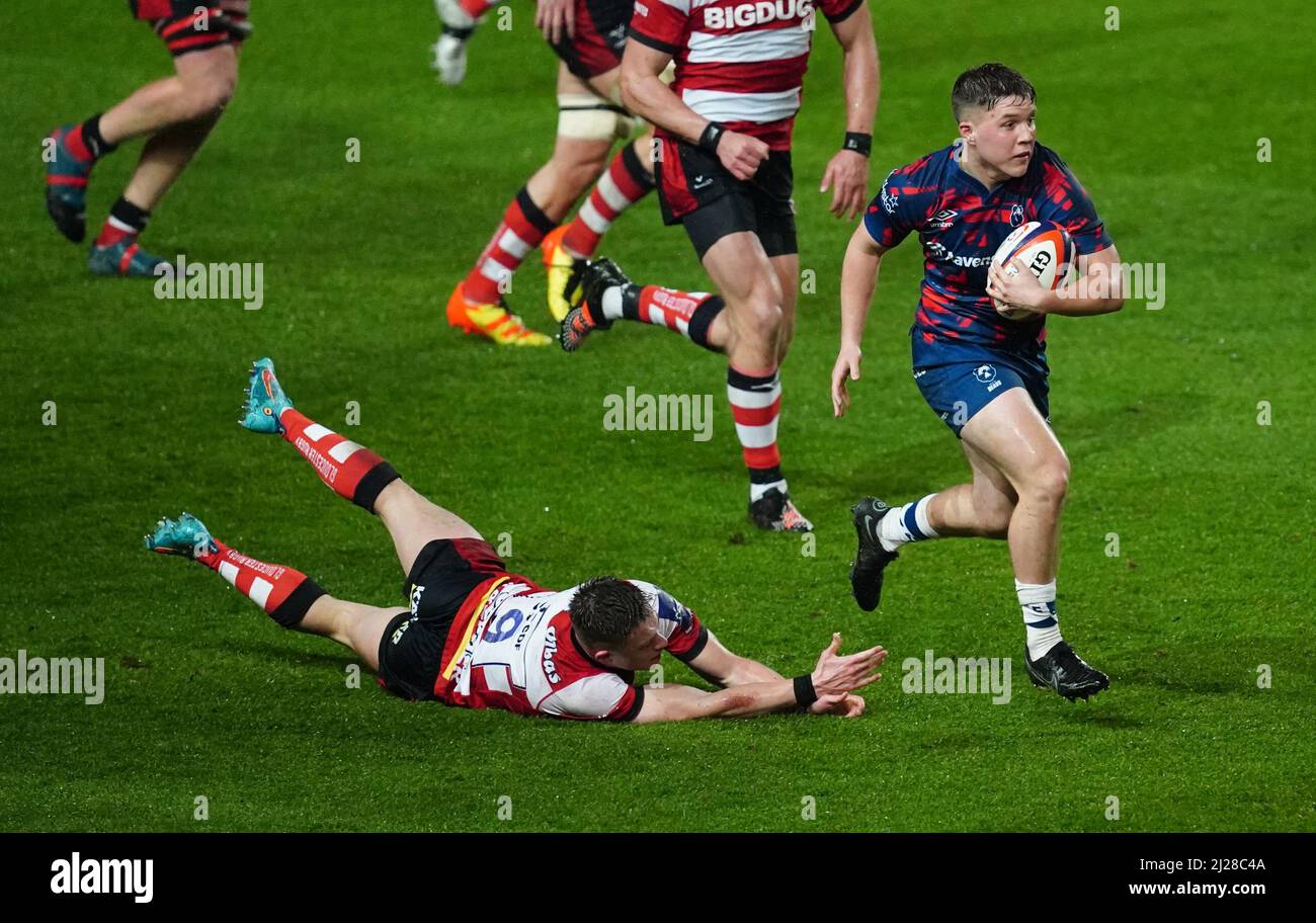 Bristol Bears' Jac Lloyd gets away from the dive of Gloucester's ...