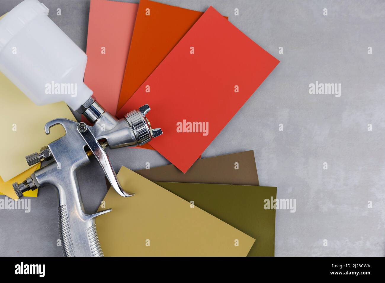 Paint spray gun at work at the workplace in the workshop. Paint Brush ...