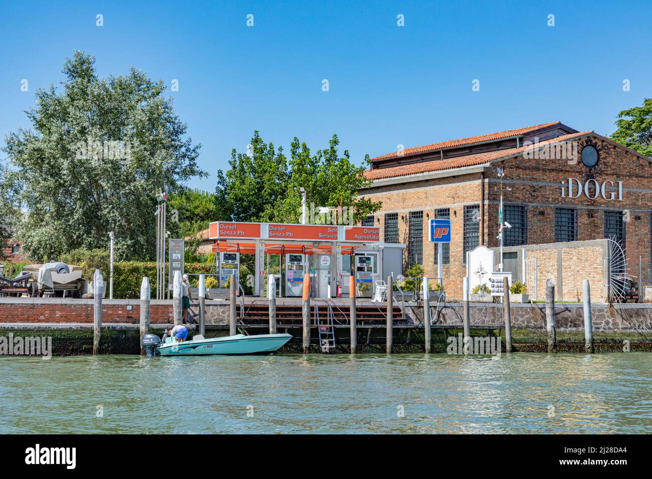 Murano, Italy - July 1, 2021: petrol station at the canal in Burano ...