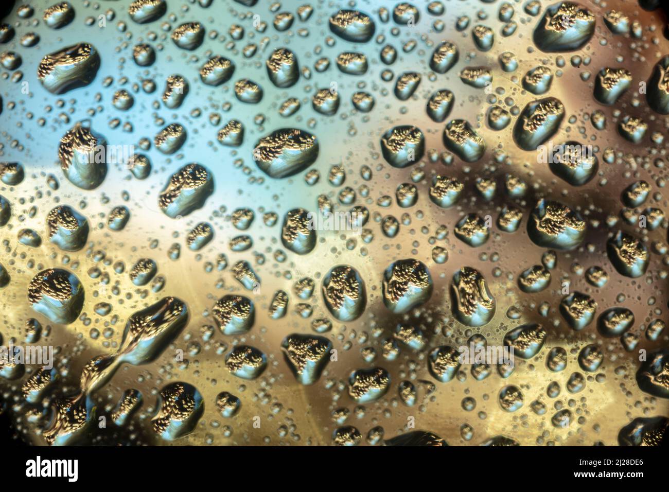 Abstract irregular water drops macro showing reflected colours Stock ...