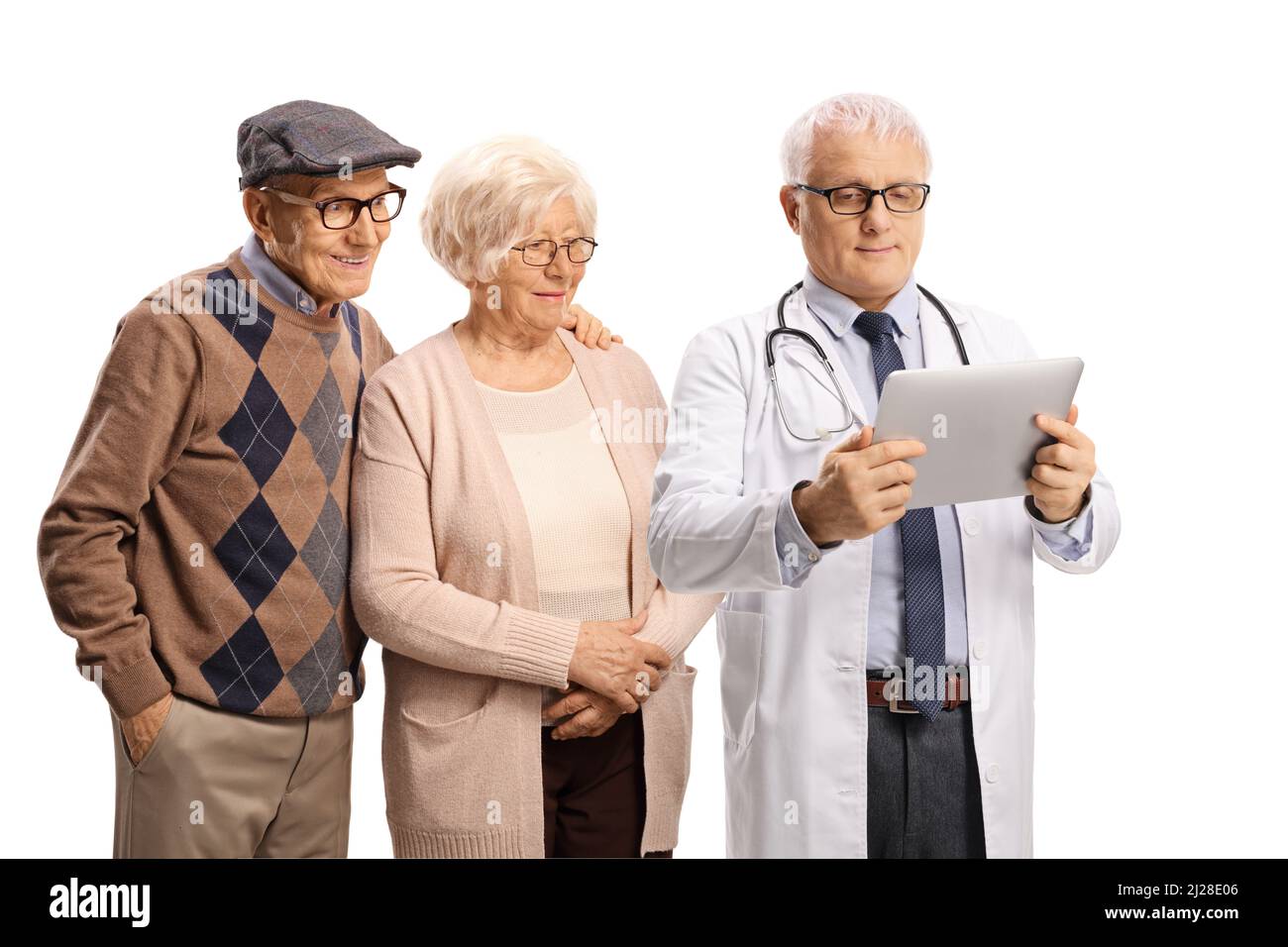 Doctor showing a digital tablet to an elderly male and female patients ...