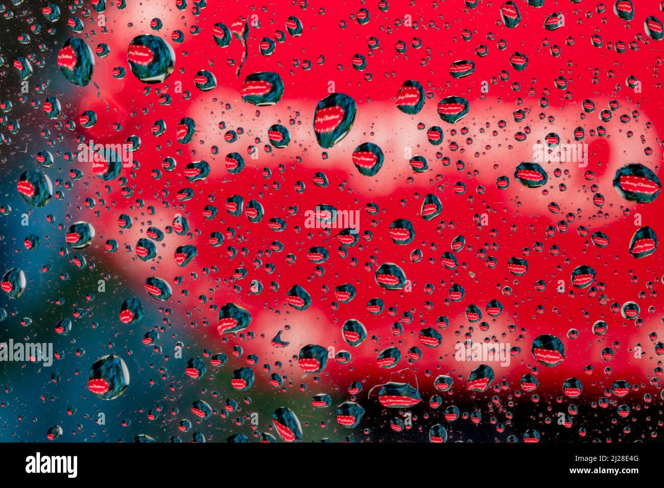 Christmas label reflected in water droplets, creative wrapping Stock ...