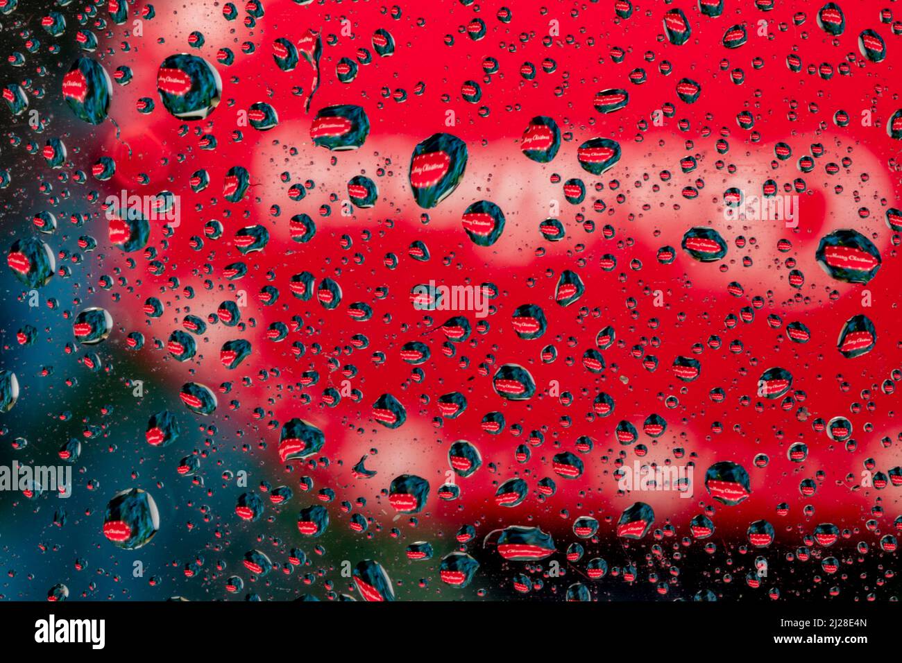 Christmas label reflected in water droplets, creative wrapping Stock ...