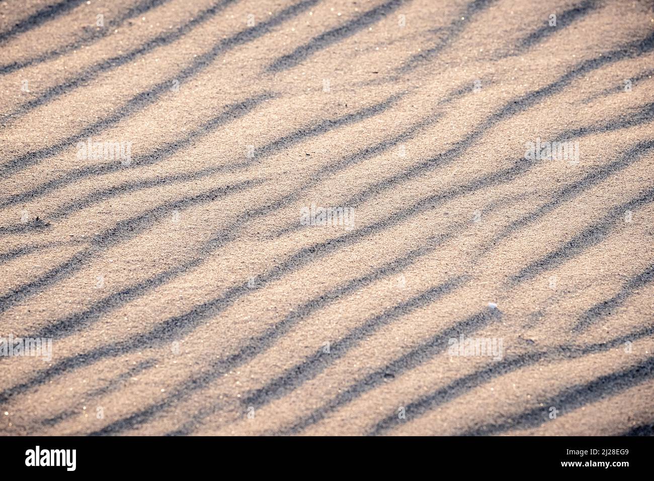 Top view of textured background with sand and smooth waves Stock Photo ...