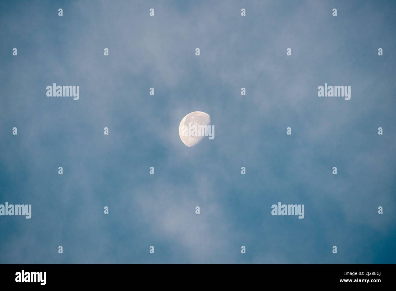 blue sky with white clouds and half moon at morning Stock Photo - Alamy
