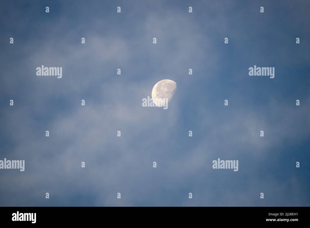blue sky with white clouds and half moon at morning Stock Photo - Alamy