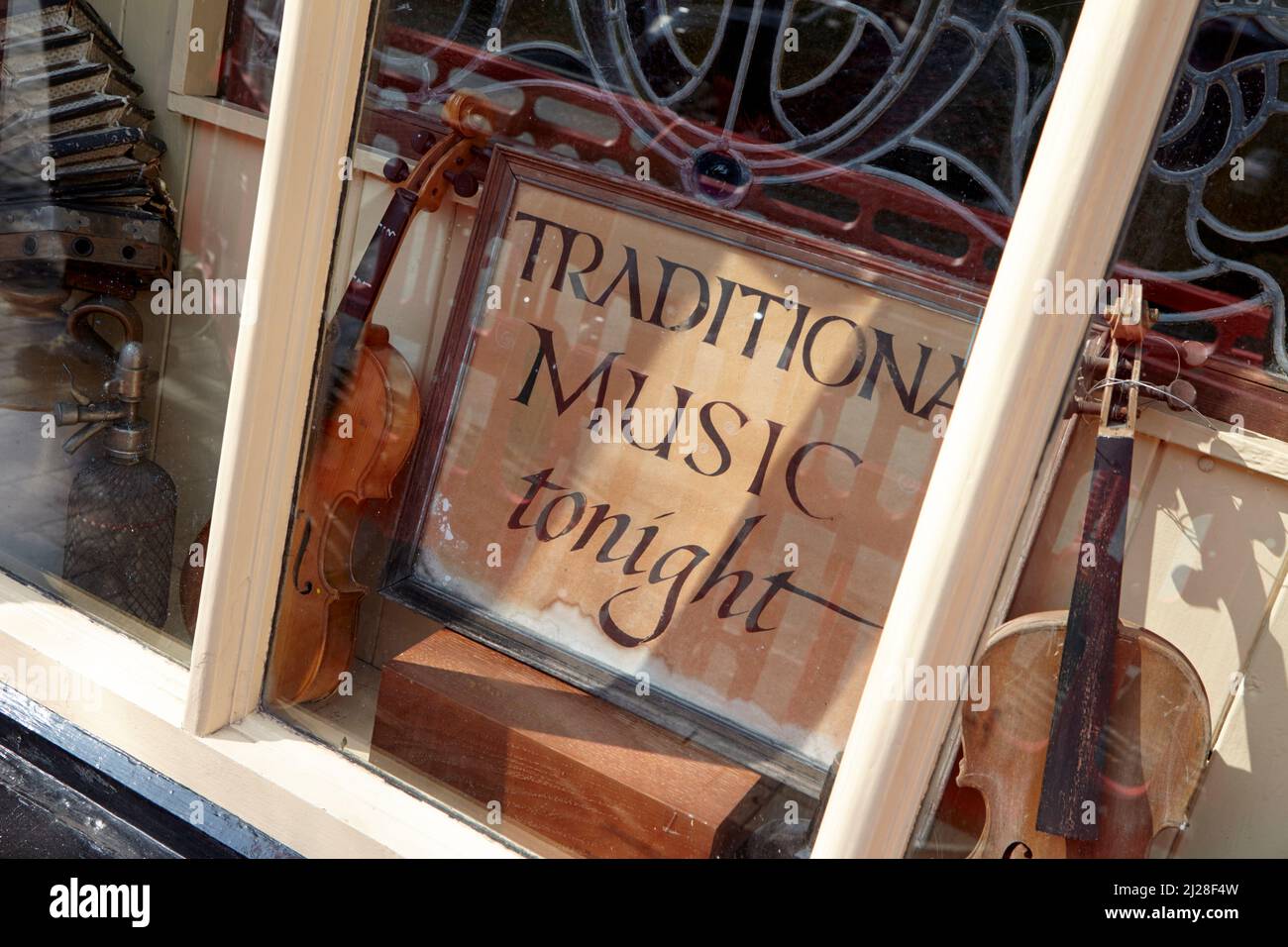traditional music tonight sign in the window of a pub in westport ...