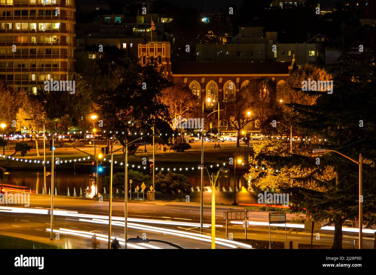 A long exposure shot of headlights and car trails of the city in the ...