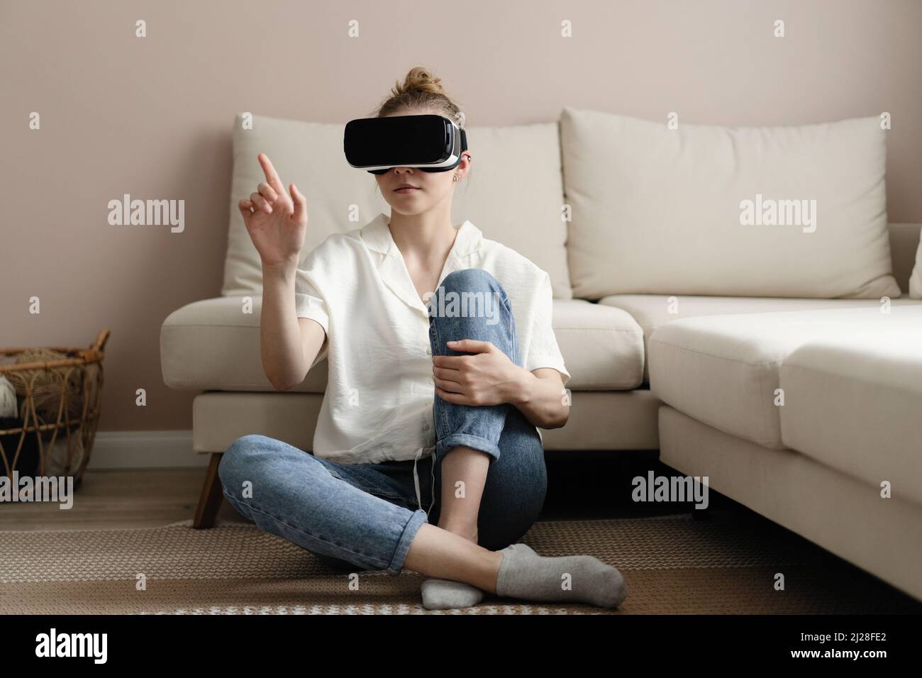 Testing new technologies. Attractive young woman in VR headset ...
