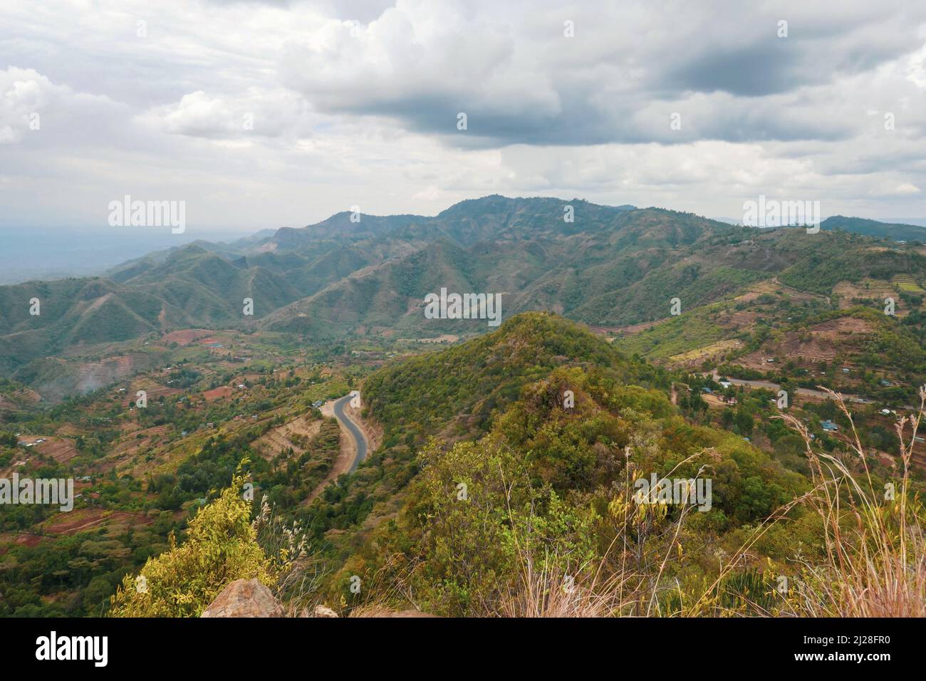 Scenic view of a mountain road and small scale settlements against the ...