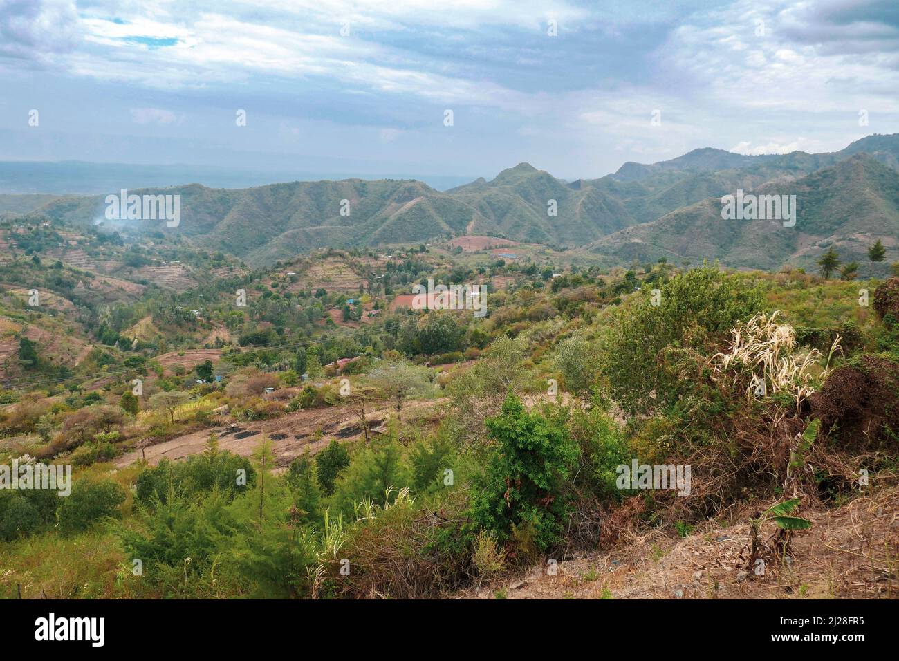Scenic view of a mountain road and small scale settlements against the ...