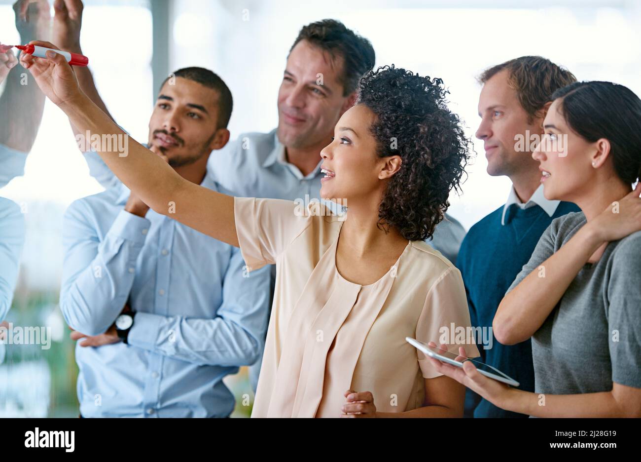 Sharing a vision of success. Shot of a diverse group of coworkers ...