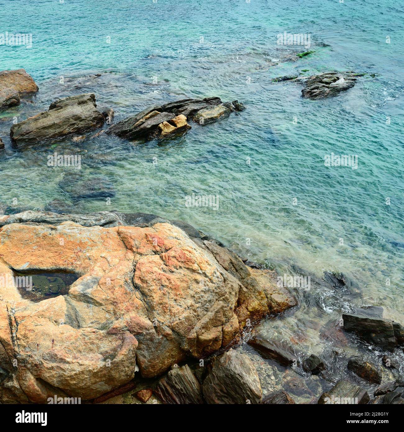Beautiful stones in the ocean Stock Photo - Alamy