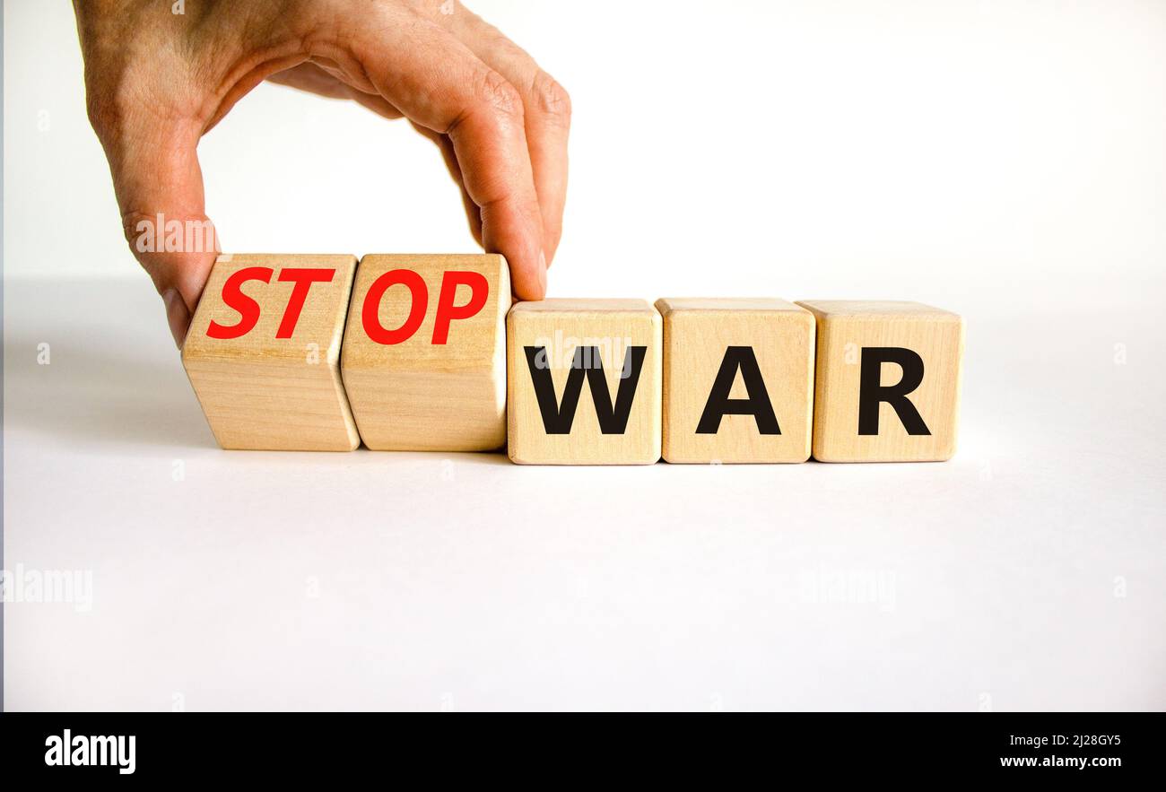 Stop war symbol. Businessman turns cubes and changes concept words War ...