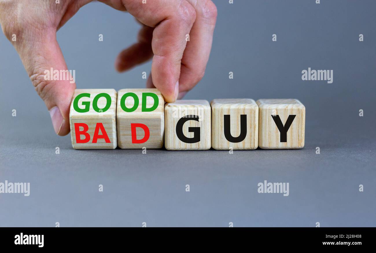 Good or bad guy symbol. Businessman turns cubes and changes concept ...