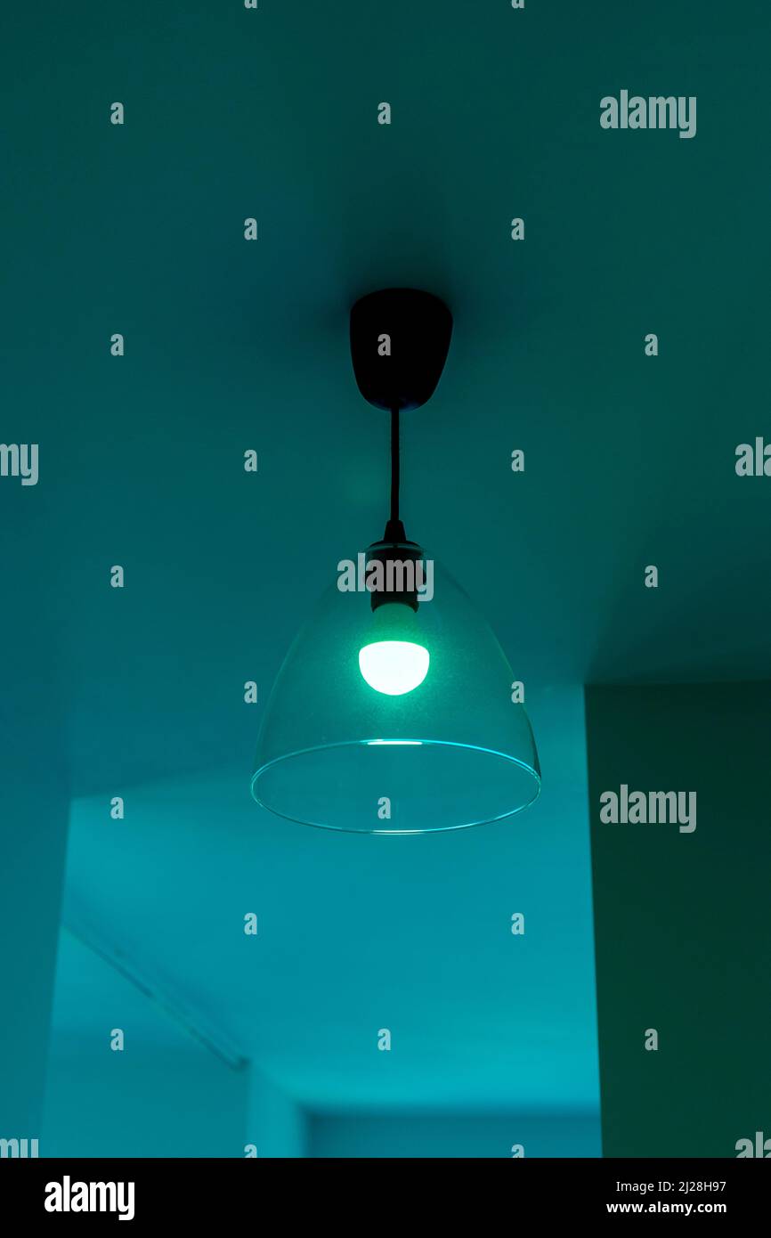 Ceiling lamp in blue light. Ceiling lamp Stock Photo - Alamy