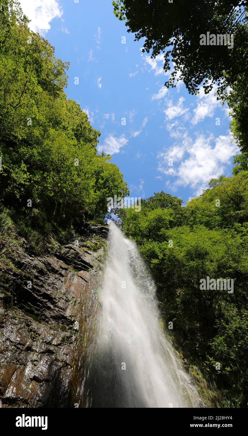 waterfall of water that flows from the top of the mountain with the ...