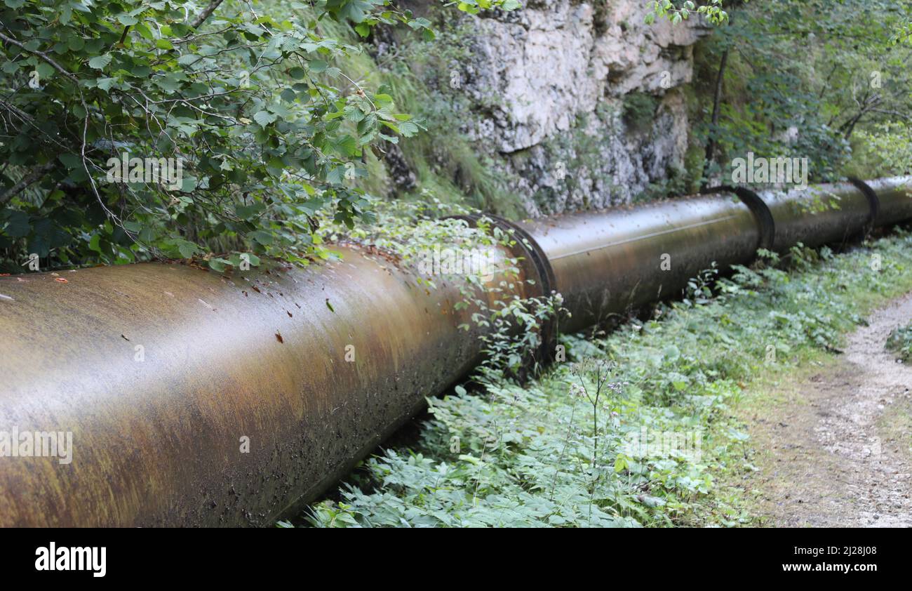large metal pipe for transporting the liquid in the middle of the ...