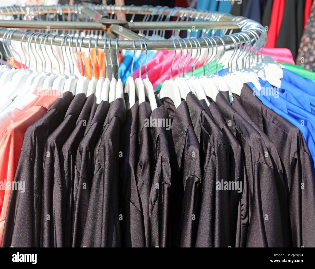 black clothes and aprons for kindergarten and elementary school hanging ...