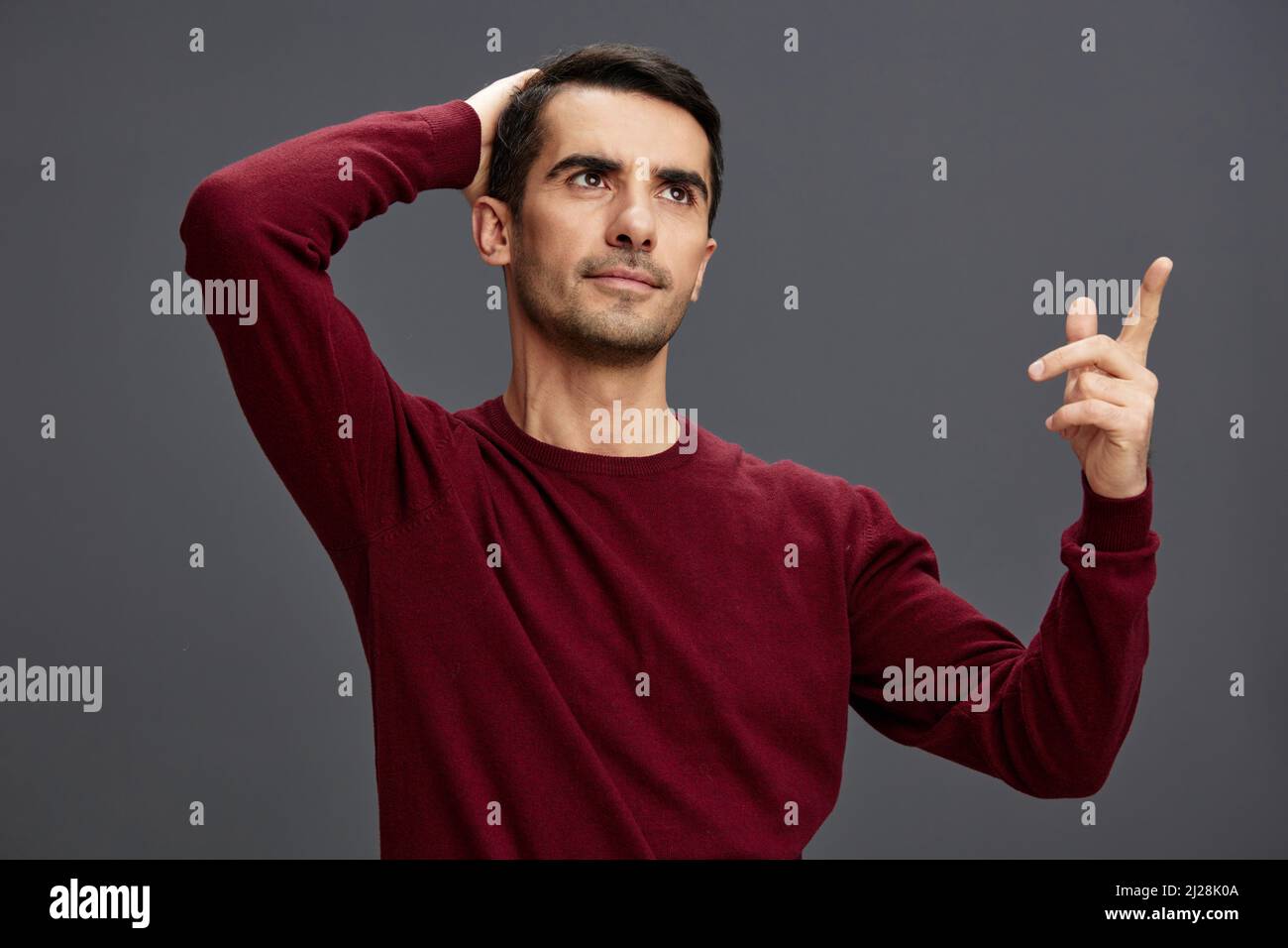 man in a red sweater hand gesture posing self confidence isolated ...