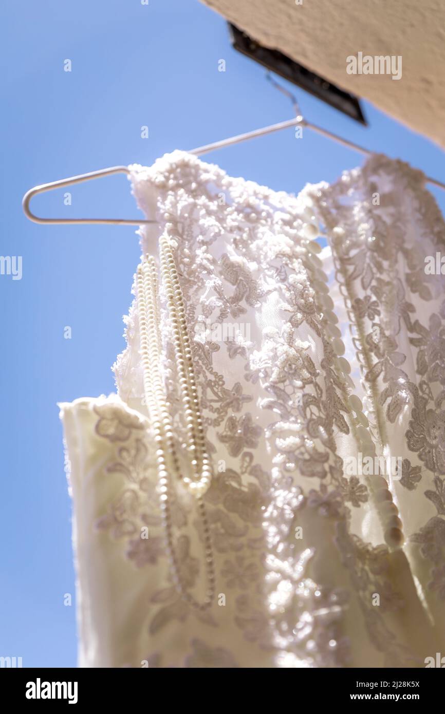 Bride getting ready, dressing, on her wedding day Stock Photo - Alamy