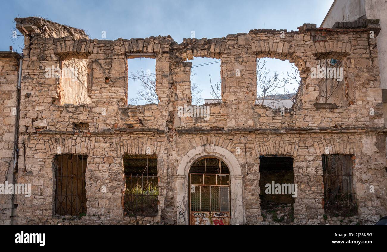 A derelict bomb damaged ruin still remaining from the war in Bosnia on ...