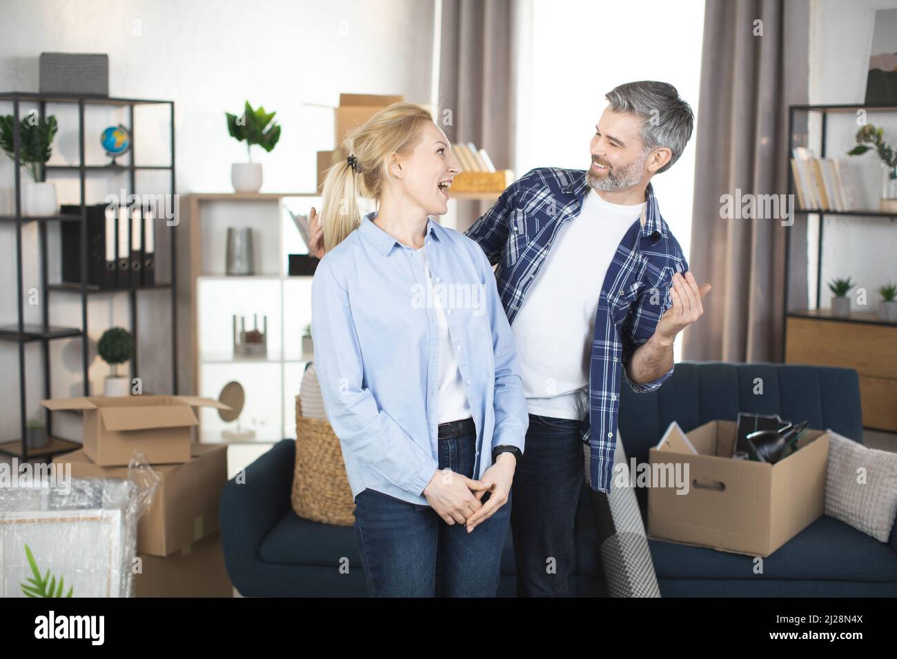 Happy family showing surprised look hi-res stock photography and images ...