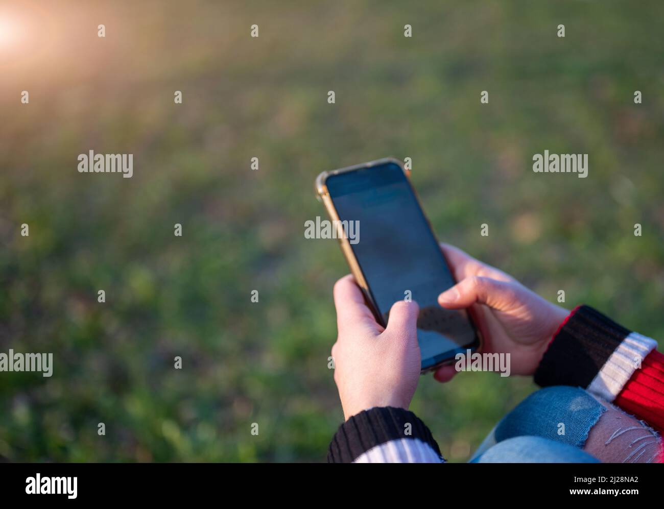 Close up shot on the smartphone screen as a young woman's fingers are ...
