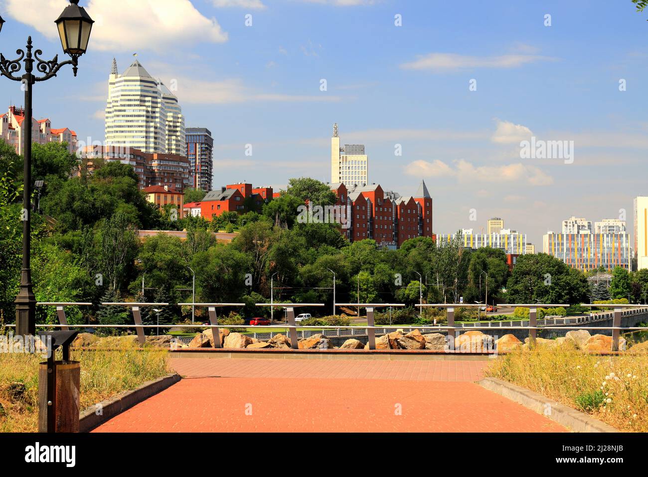 Beautiful tall white towers, skyscrapers, red buildings, park against ...