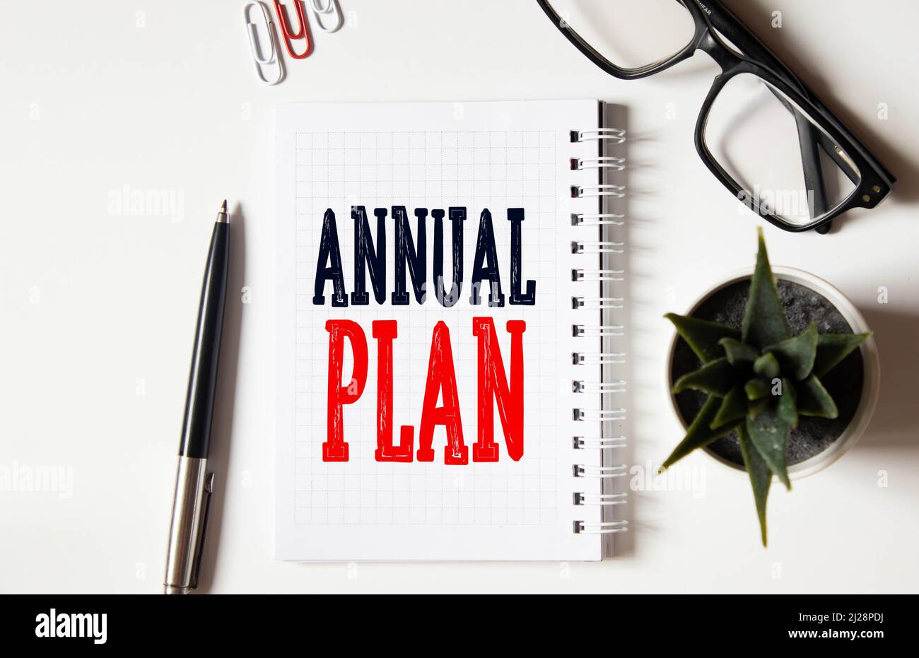 ANNUAL PLAN Conceptual background with calculator and papers charts ...