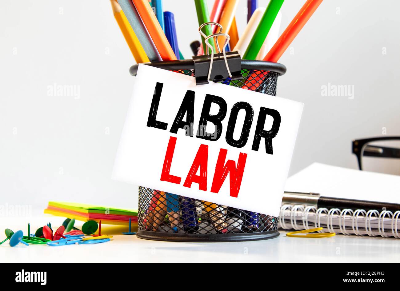 white paper on the white background with text Labor Law Stock Photo - Alamy