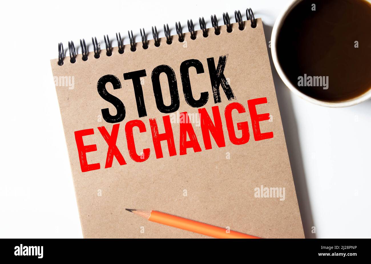stock exchange written on newspaper on keyboard Stock Photo - Alamy