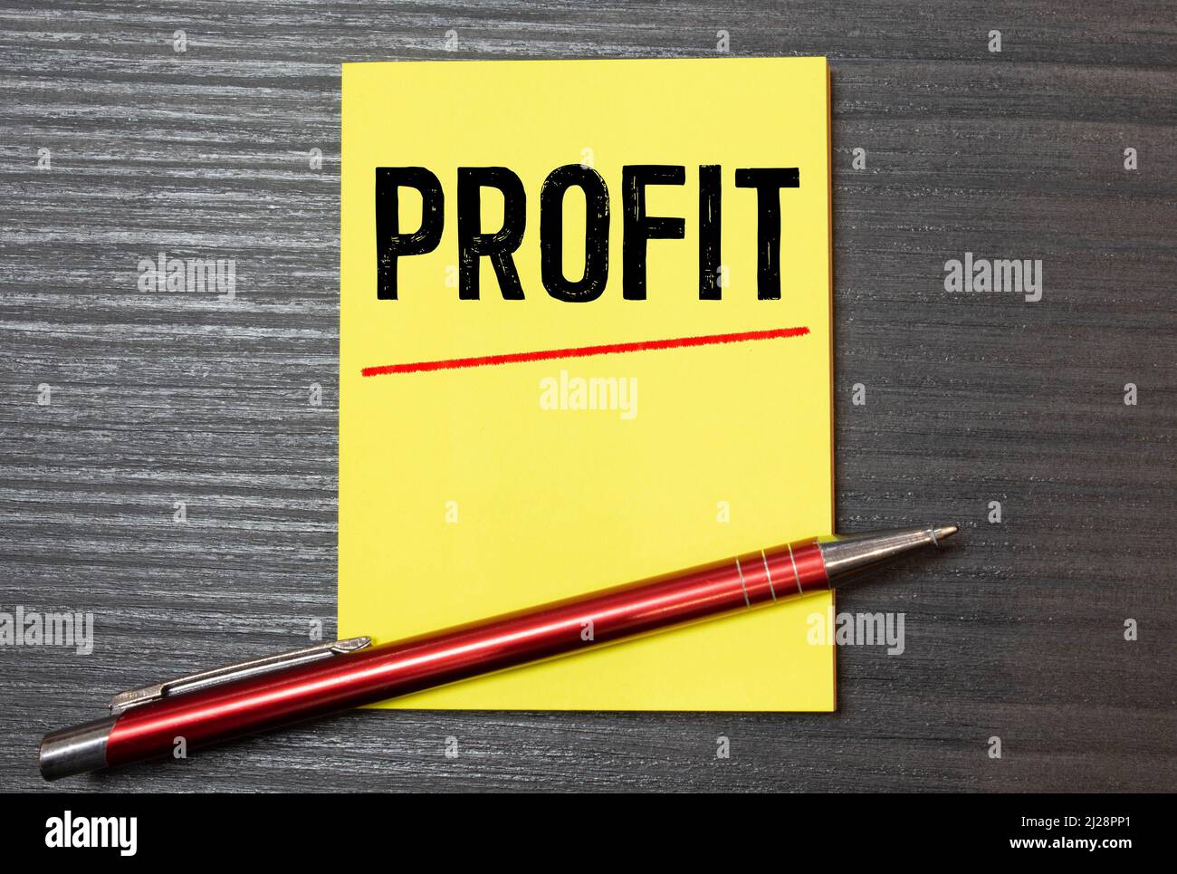 Profit word on yellow spiral notebook analytical chart documents with ...