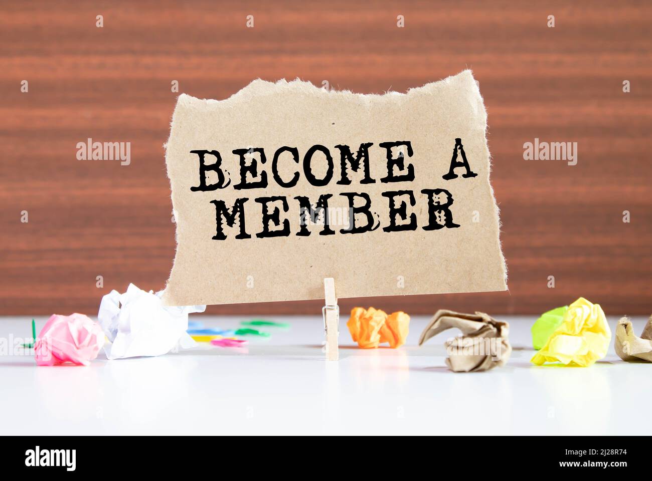 Top angle view of pen and notebook written with text BECOME A MEMBER ...