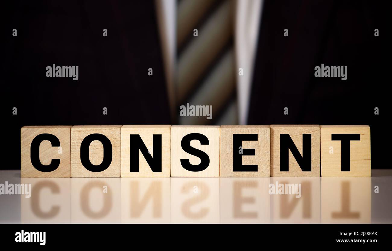 Consent word from wooden blocks on desk Stock Photo - Alamy