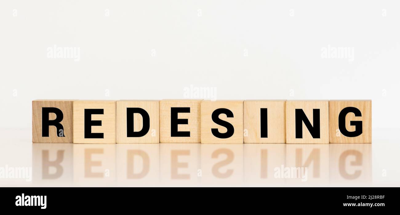 REDESIGN word made with building blocks, concept Stock Photo - Alamy