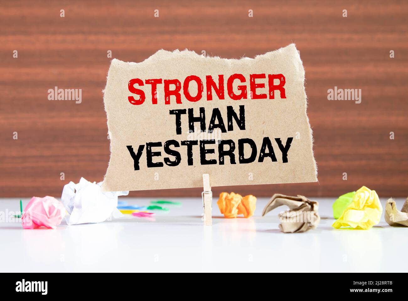 stronger than yesterday white chalk text on a vintage slate blackboard ...