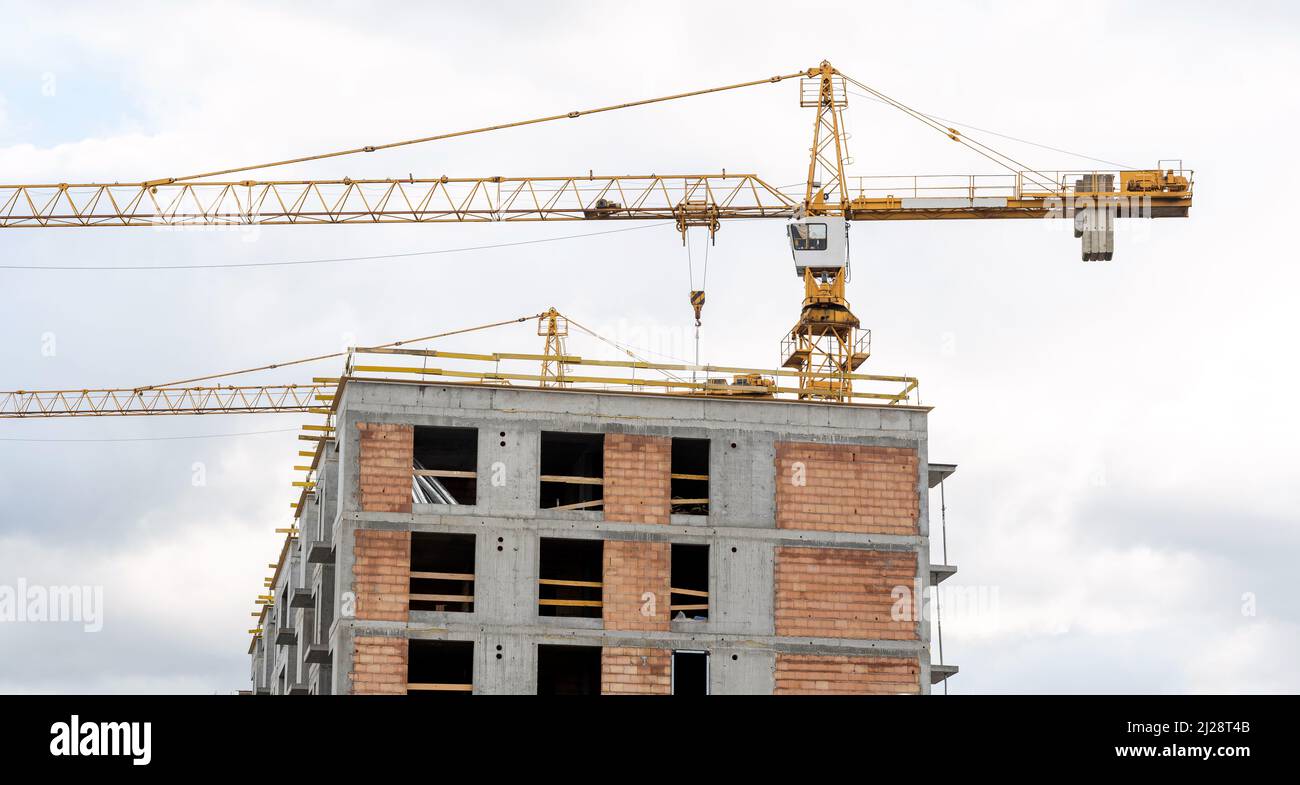 Construction site, generic unfinished empty residential building and a ...