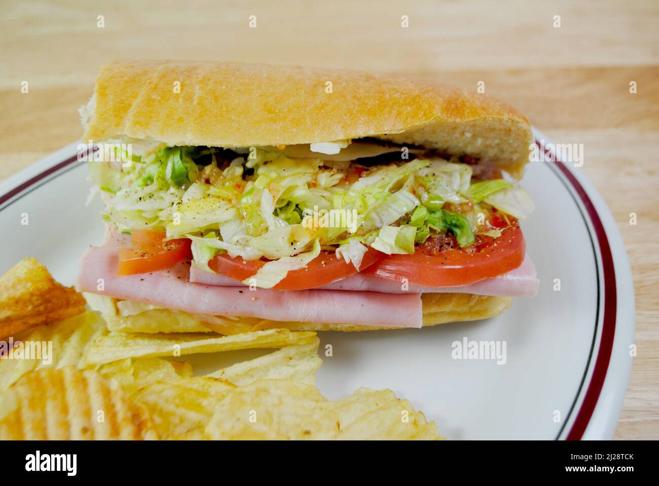 A Sub Sandwich with Potato Chips Served as a Cold Lunch Stock Photo - Alamy