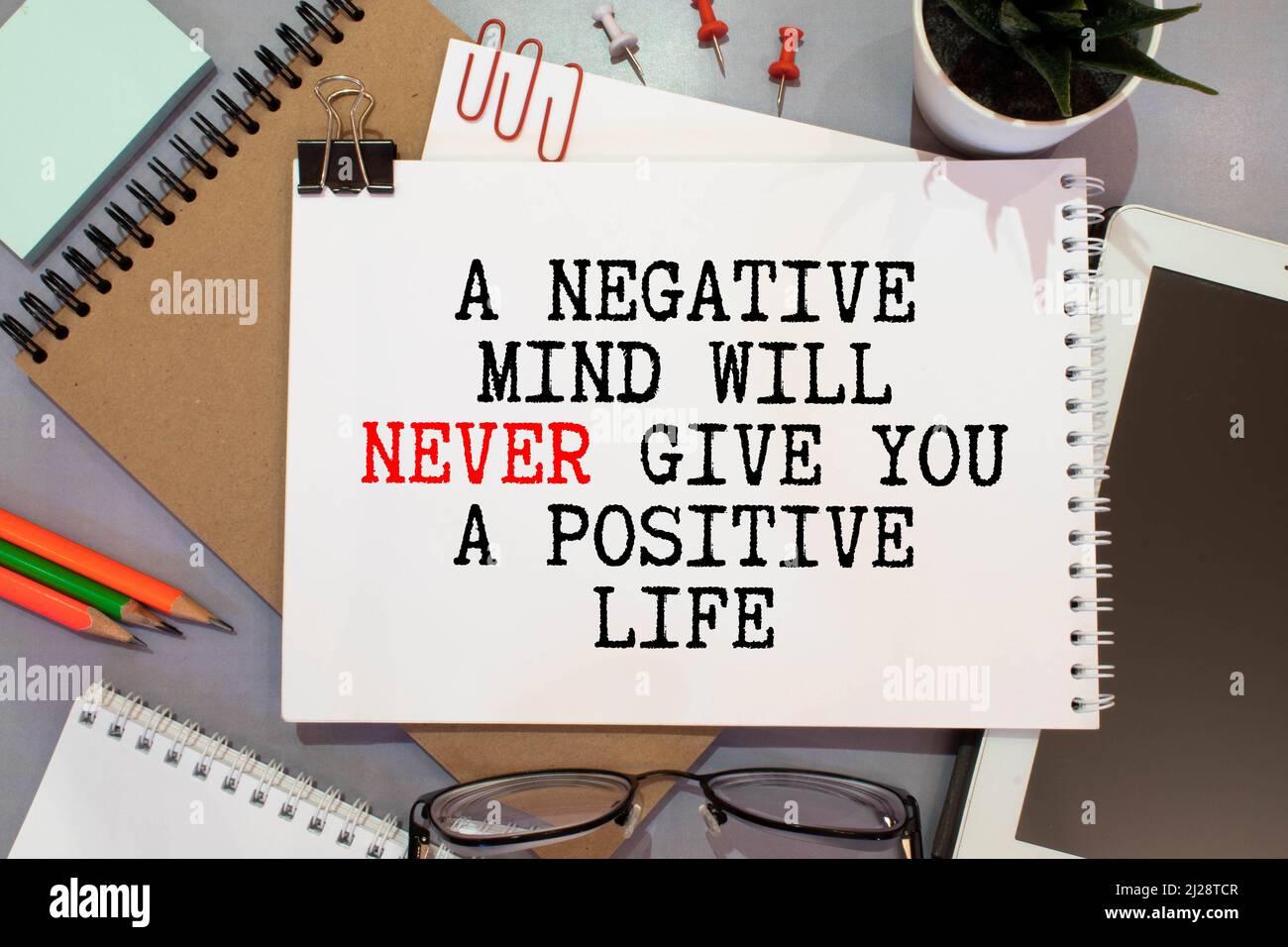 The text A negative mind will never give you a positive life. Motivational quote Stock Photo - Alamy